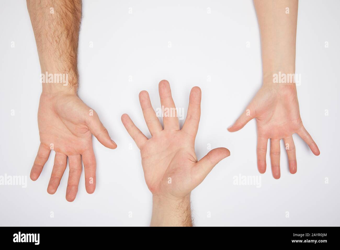 top view of three people showing palms isolated on white Stock Photo ...