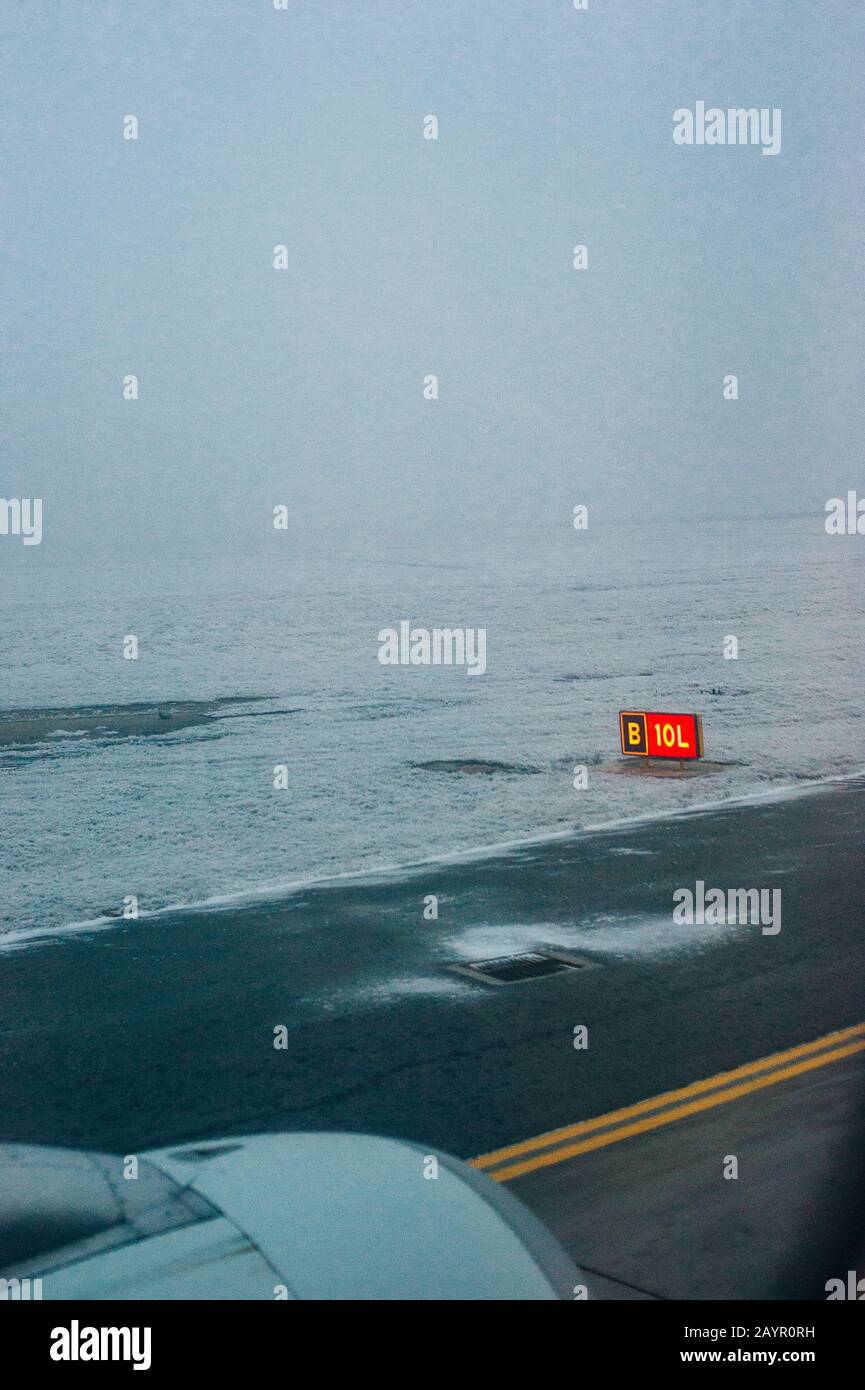 Airport and winter runway, view from a height to a snow-covered ...