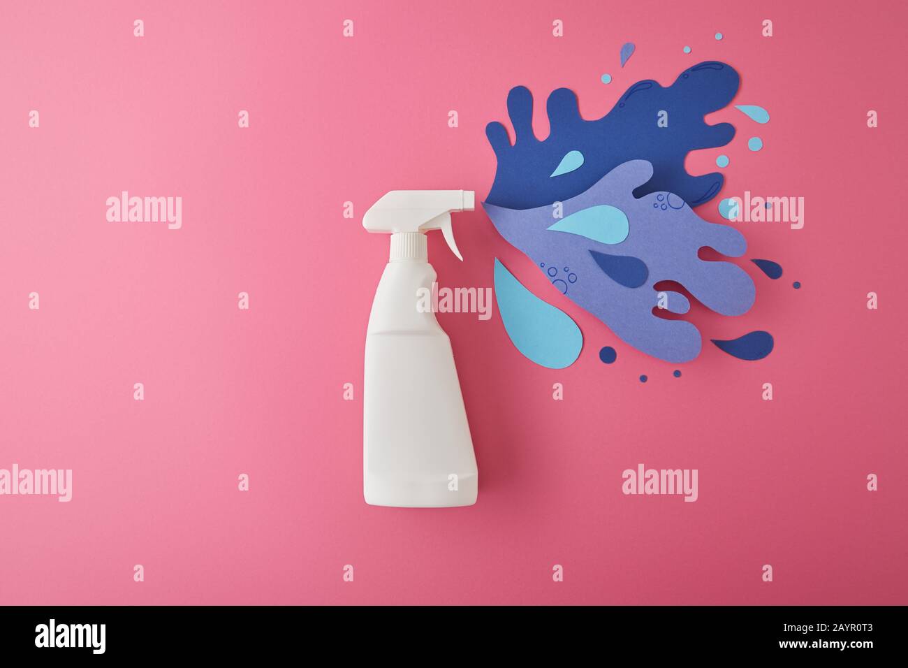 composition with detergent spray bottle and water splash made of paper ...