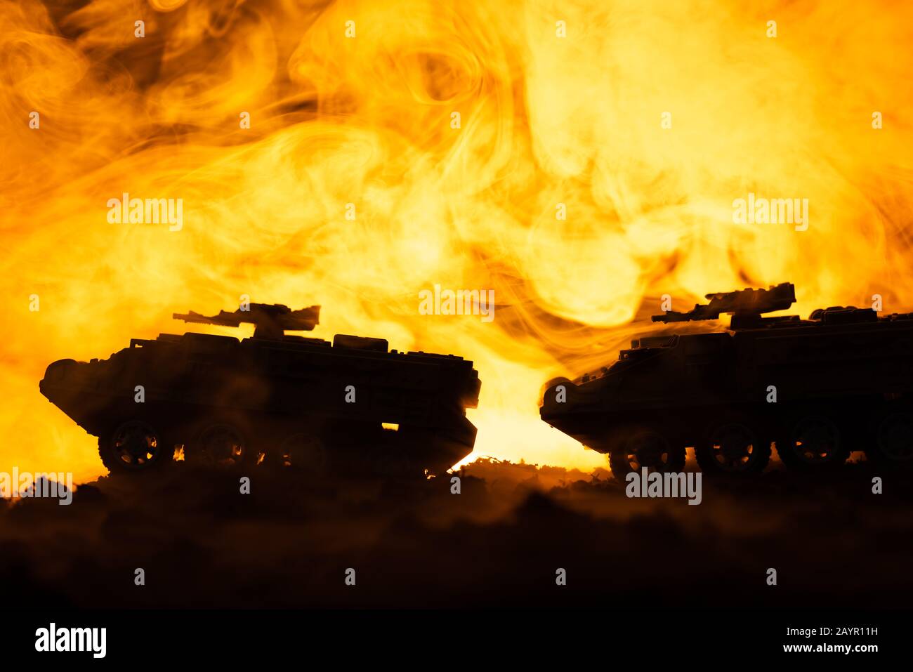 Battle scene with toy tanks and fire at background Stock Photo - Alamy