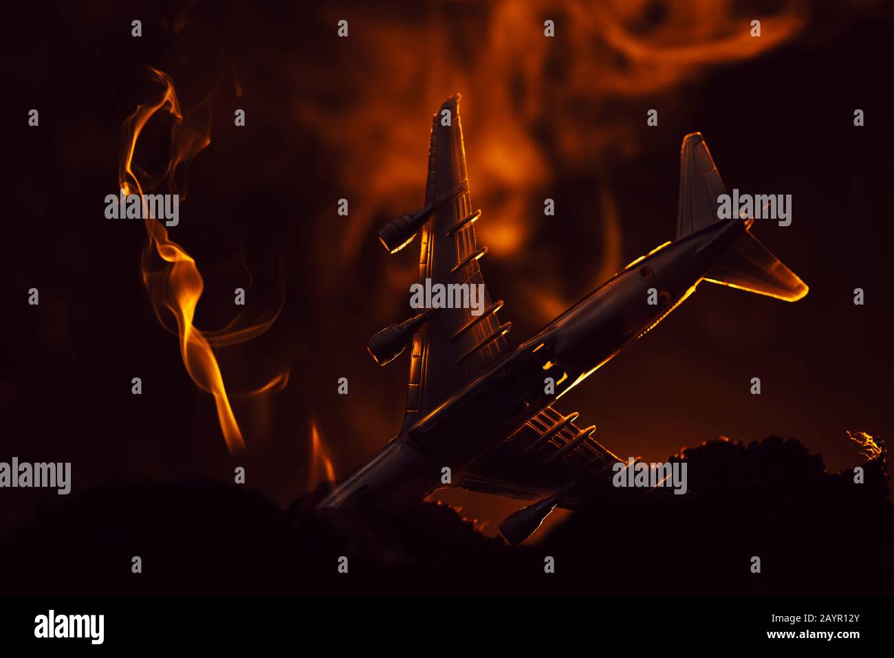 Crash of toy plane with smoke on black background, battle scene Stock ...