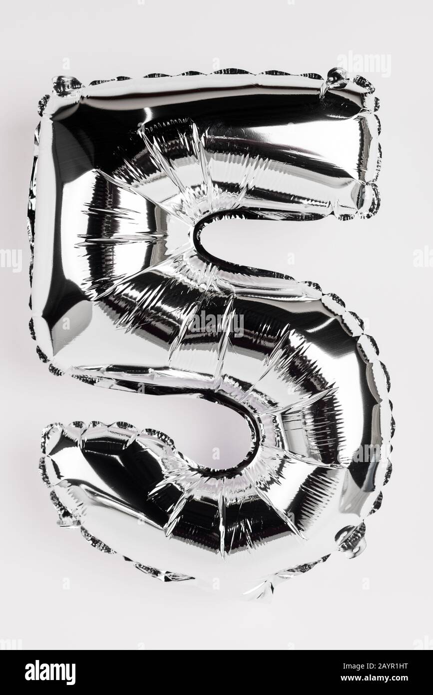 Silver balloon in shape of five number on grey background Stock Photo ...