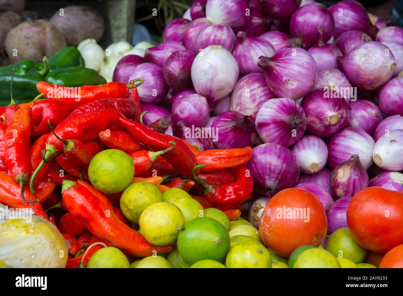 Chili peppers and onions for sale on the local food market in the town ...