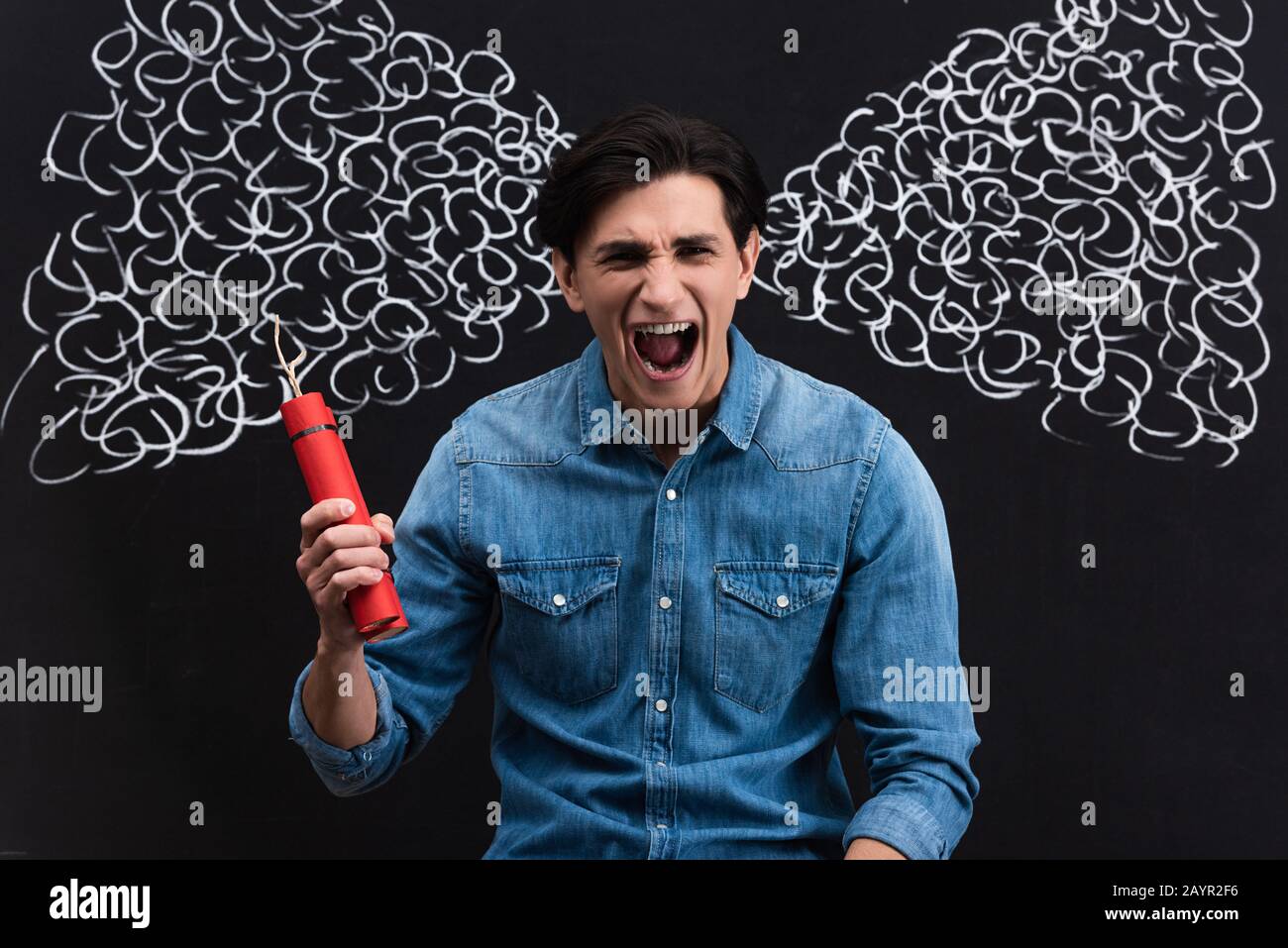 angry young man shouting and holding dynamite, with steam drawing on ...