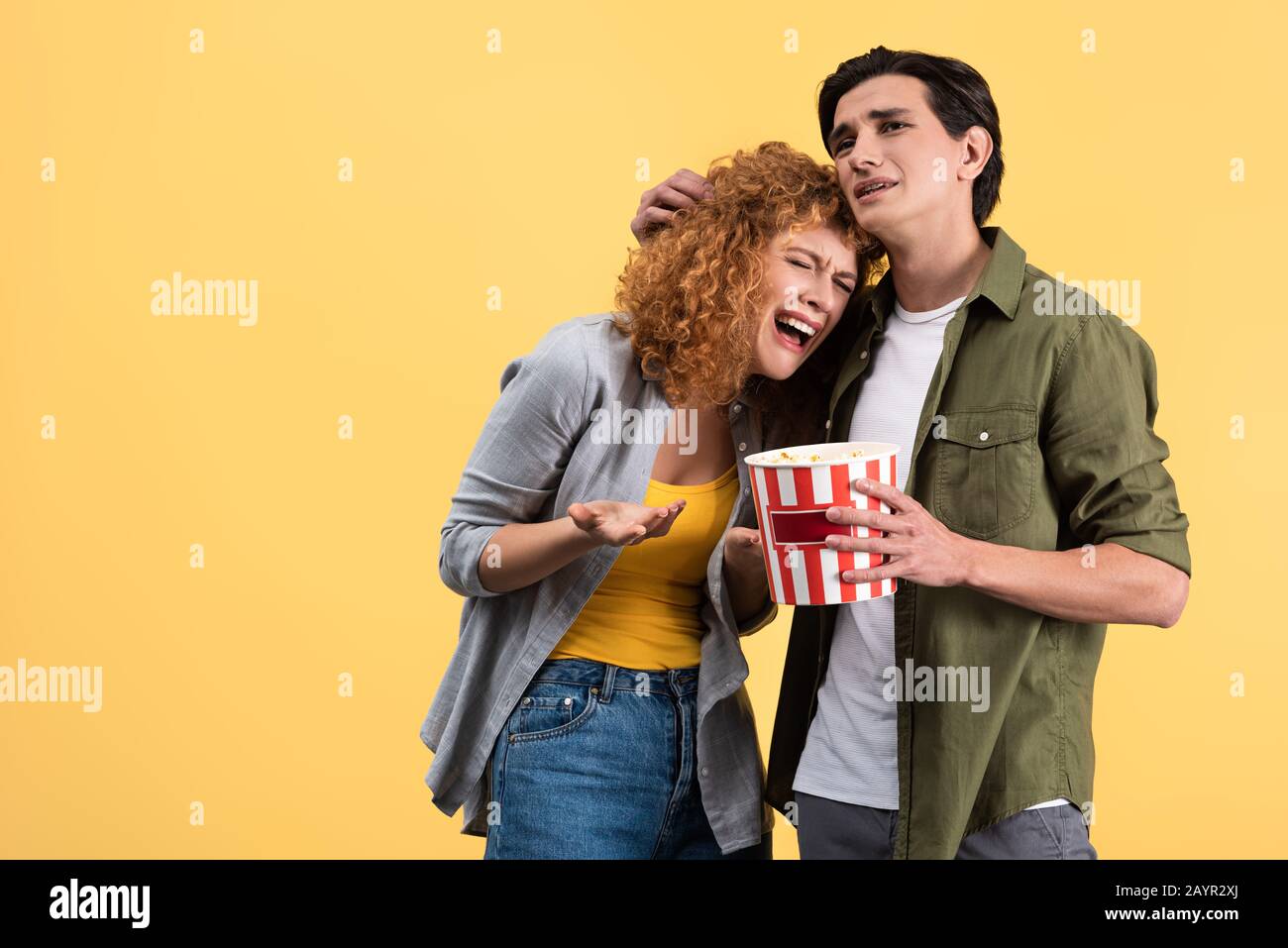 upset boyfriend hugging crying girlfriend while watching drama movie ...