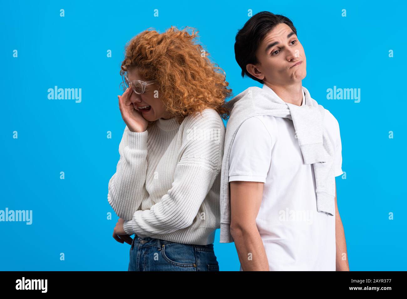 crying girlfriend and skeptical boyfriend standing back to back ...