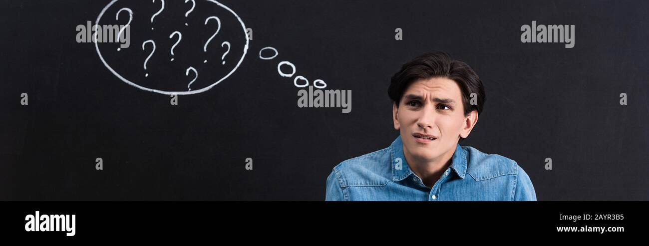 Confused man question marks hi-res stock photography and images - Alamy