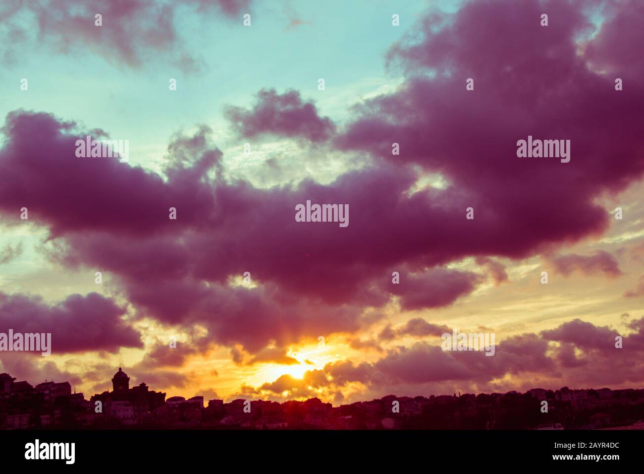 Grey color clouds partly cover the sky in the daytime Stock Photo - Alamy