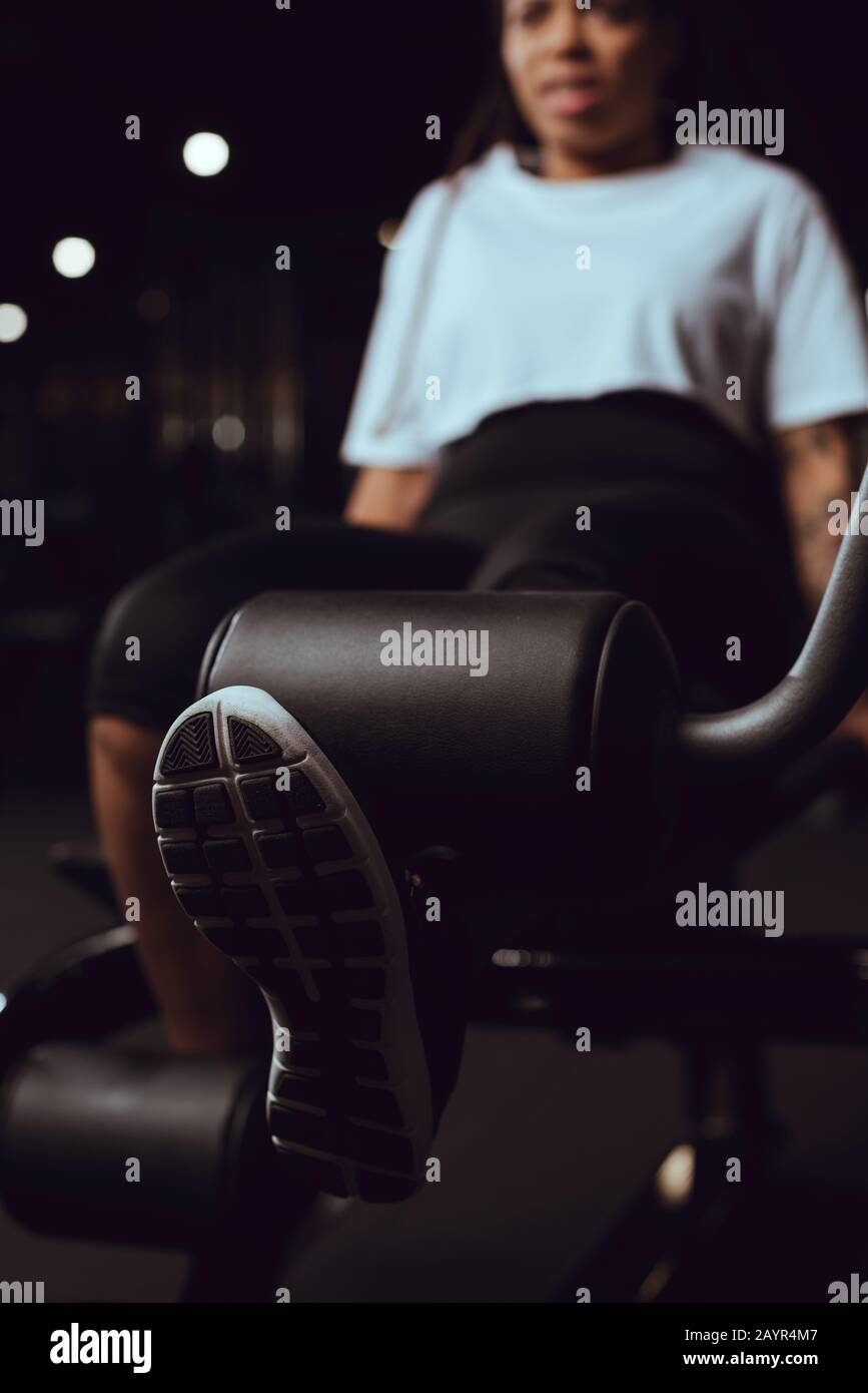 Selective focus of african american woman doing exercise for legs Stock ...