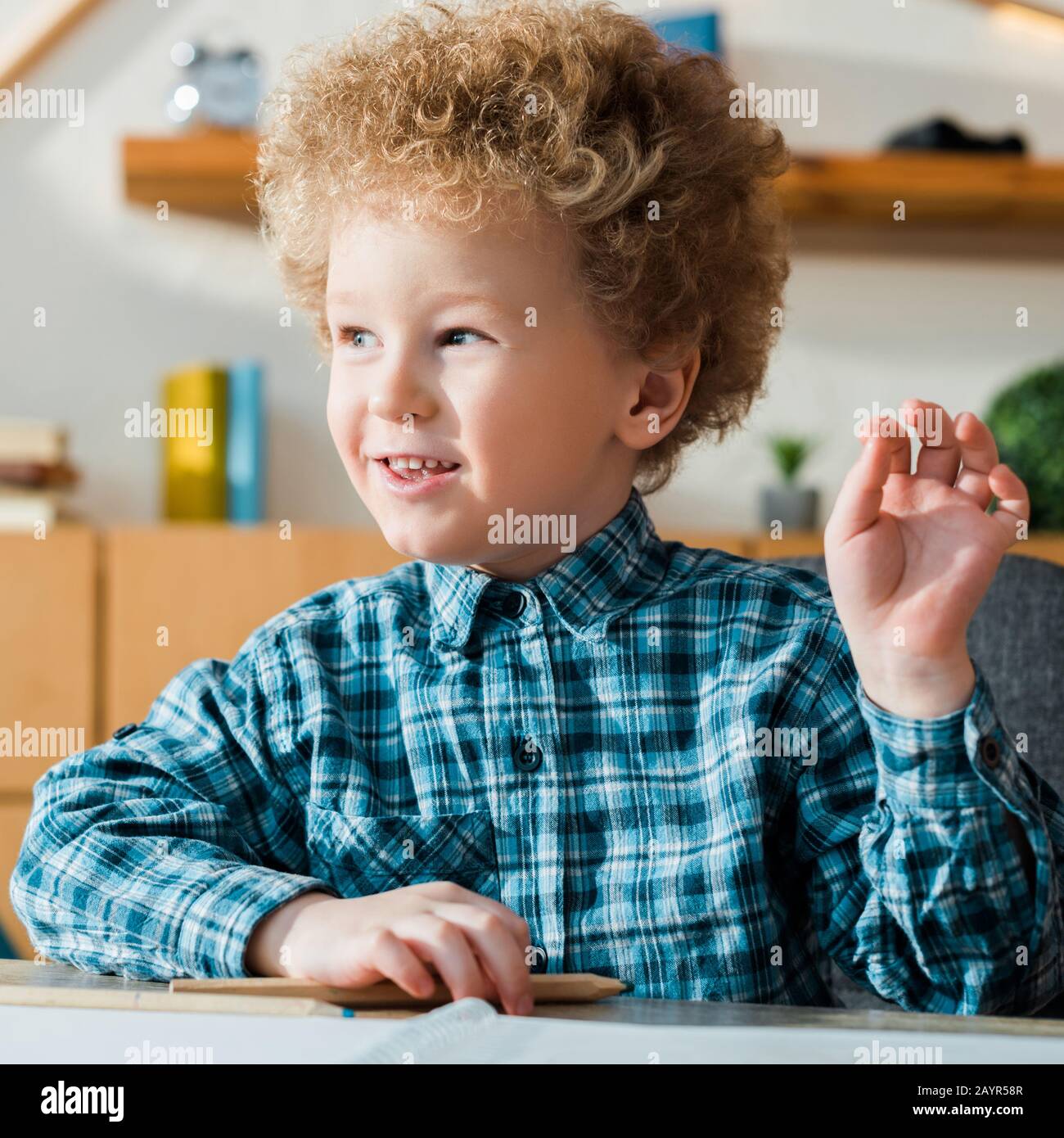 happy kid smiling while looking away Stock Photo - Alamy