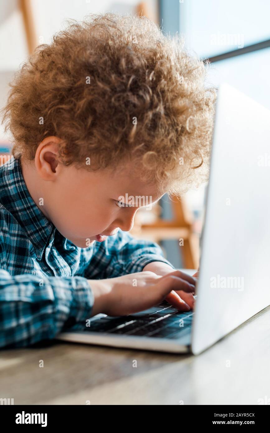 Boy profile study typing hi-res stock photography and images - Alamy
