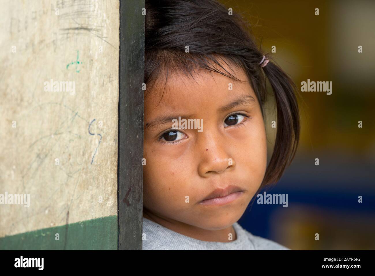 Portrait of a sad looking Kichwa native girl at the native community O ...