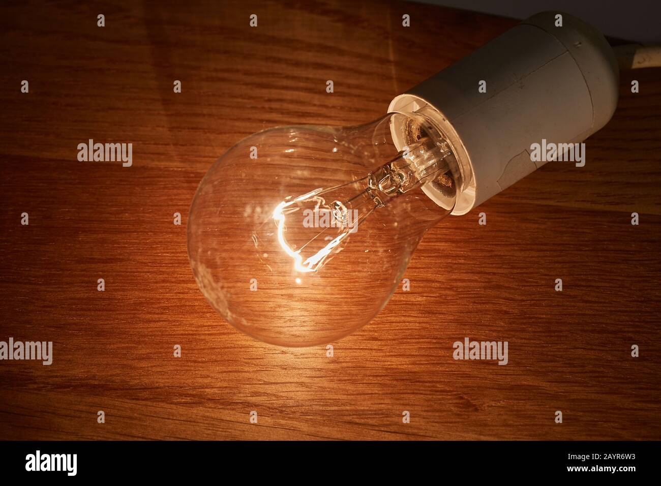 Light bulb on a table Stock Photo - Alamy