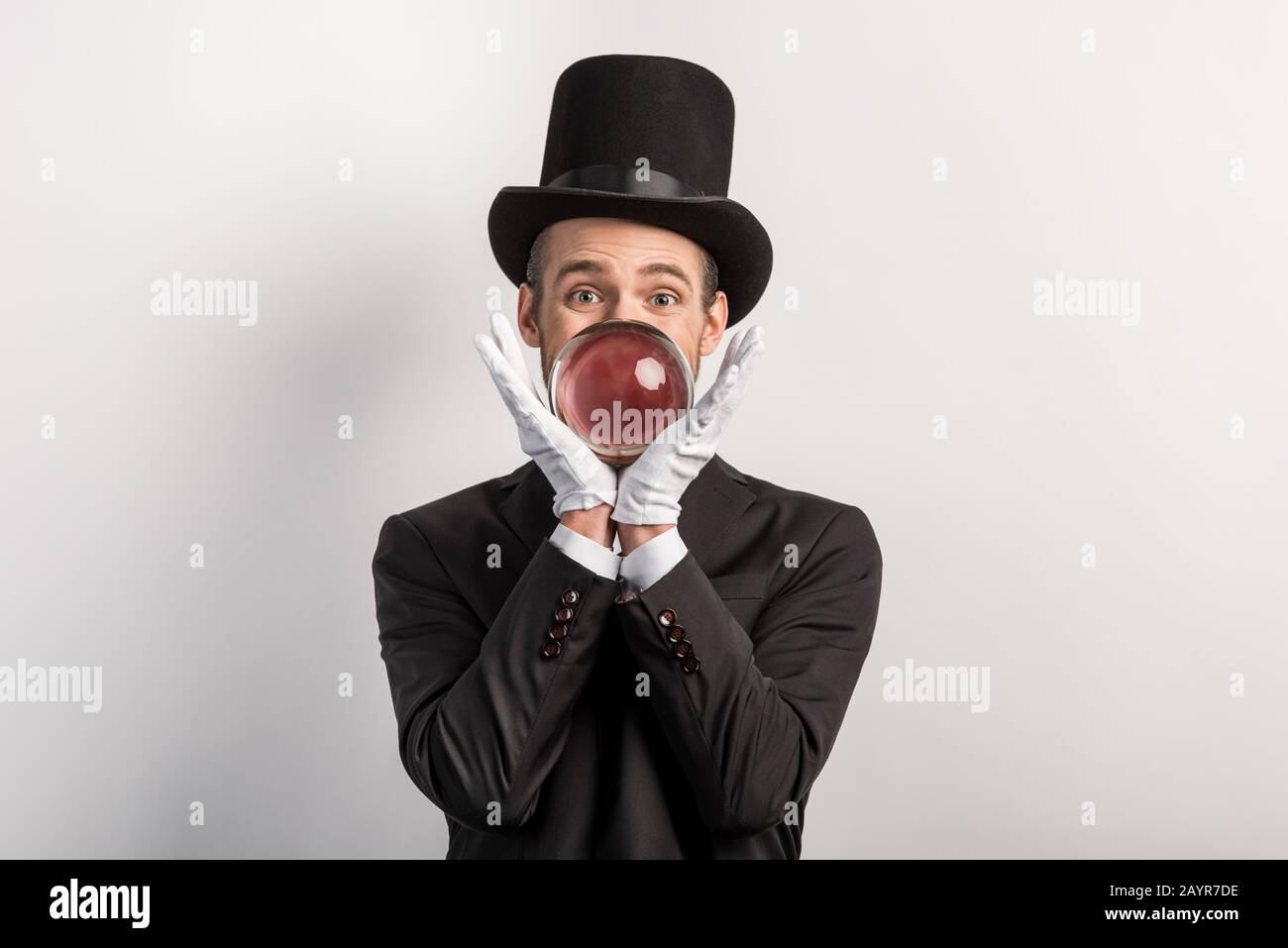 professional magician holding magic ball, isolated on grey Stock Photo ...