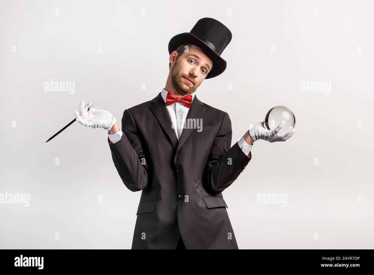 magician with shrug gesture holding wand and magic ball, isolated on ...