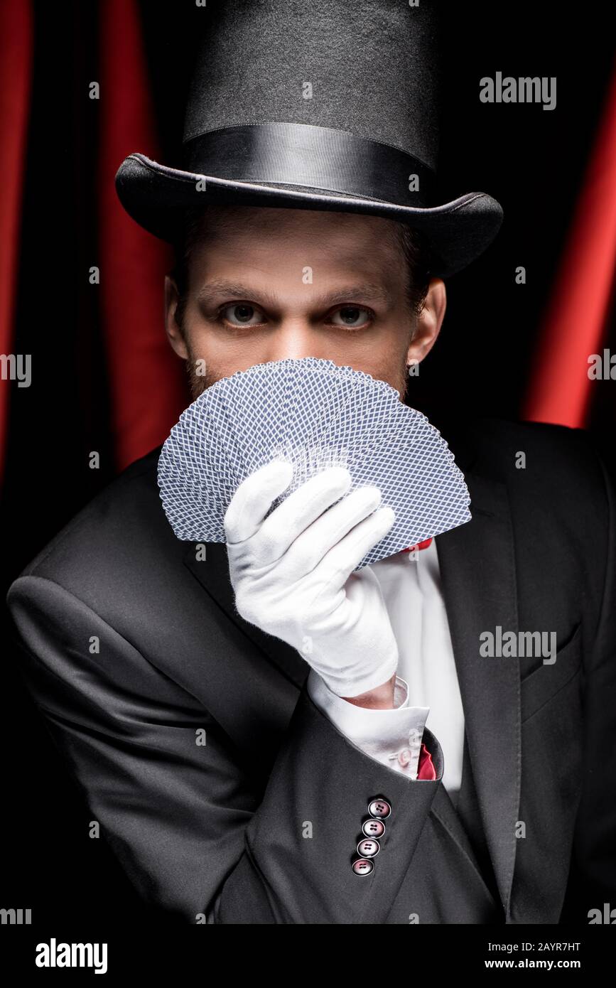 Magician Holding Cards