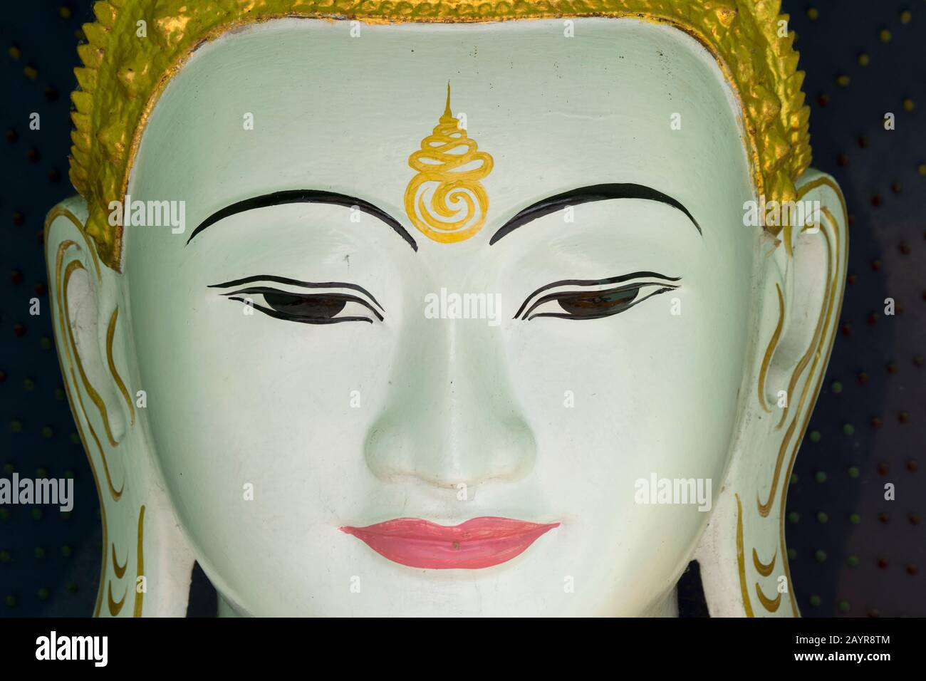 Close-up of the face of a Buddha statue in one of the temples of the ...
