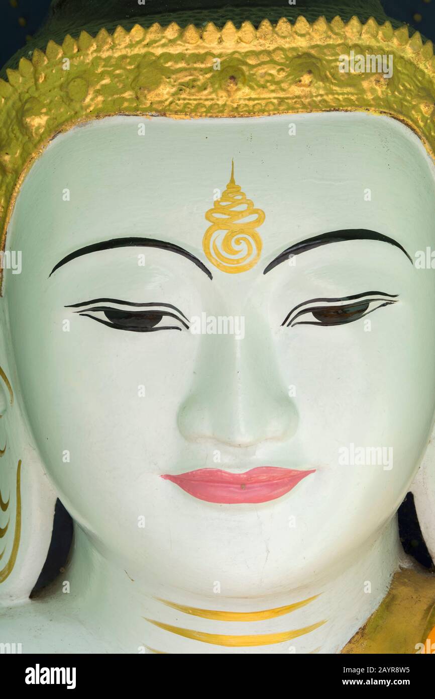 Close-up of the face of a Buddha statue in one of the temples of the ...