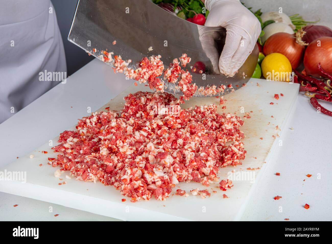 meat kebab restaurant chefs, making minced meat in Turkey. Meat mincing ...