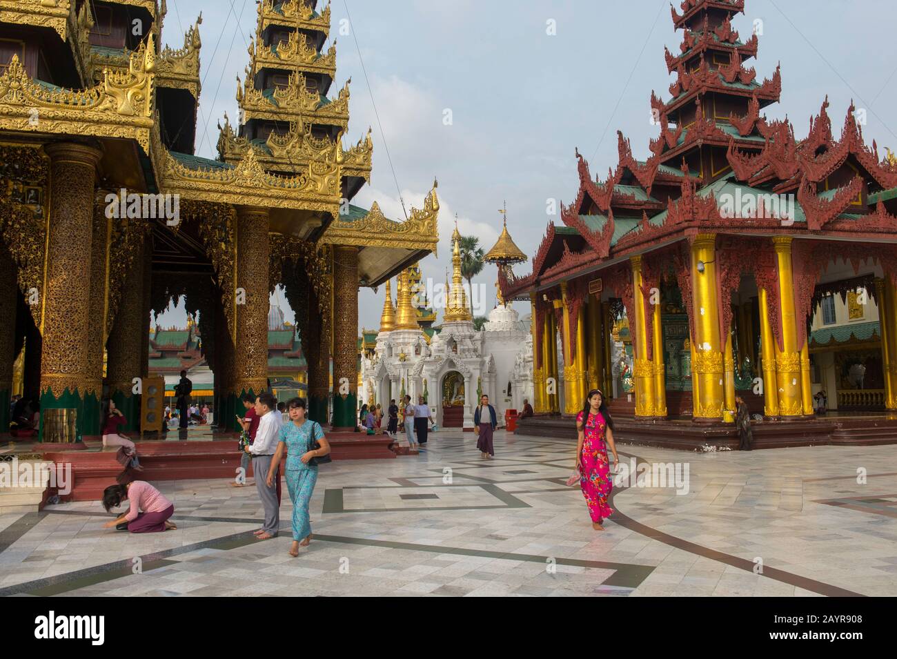 People walking around the 2,500 years old Shwedagon Pagoda in Yangon ...