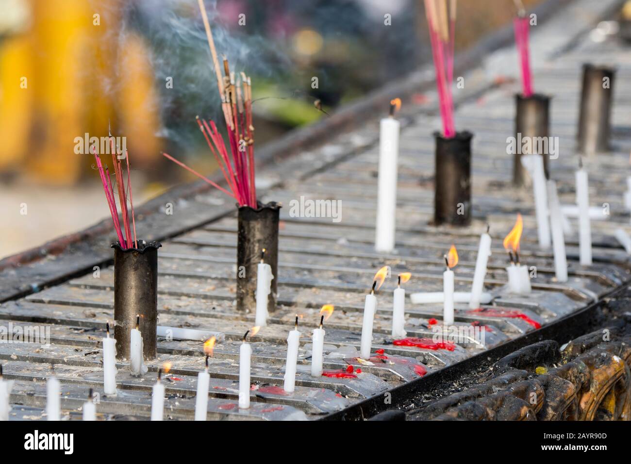 Candle and incense offerings at the 2,500 years old Shwedagon Pagoda in ...