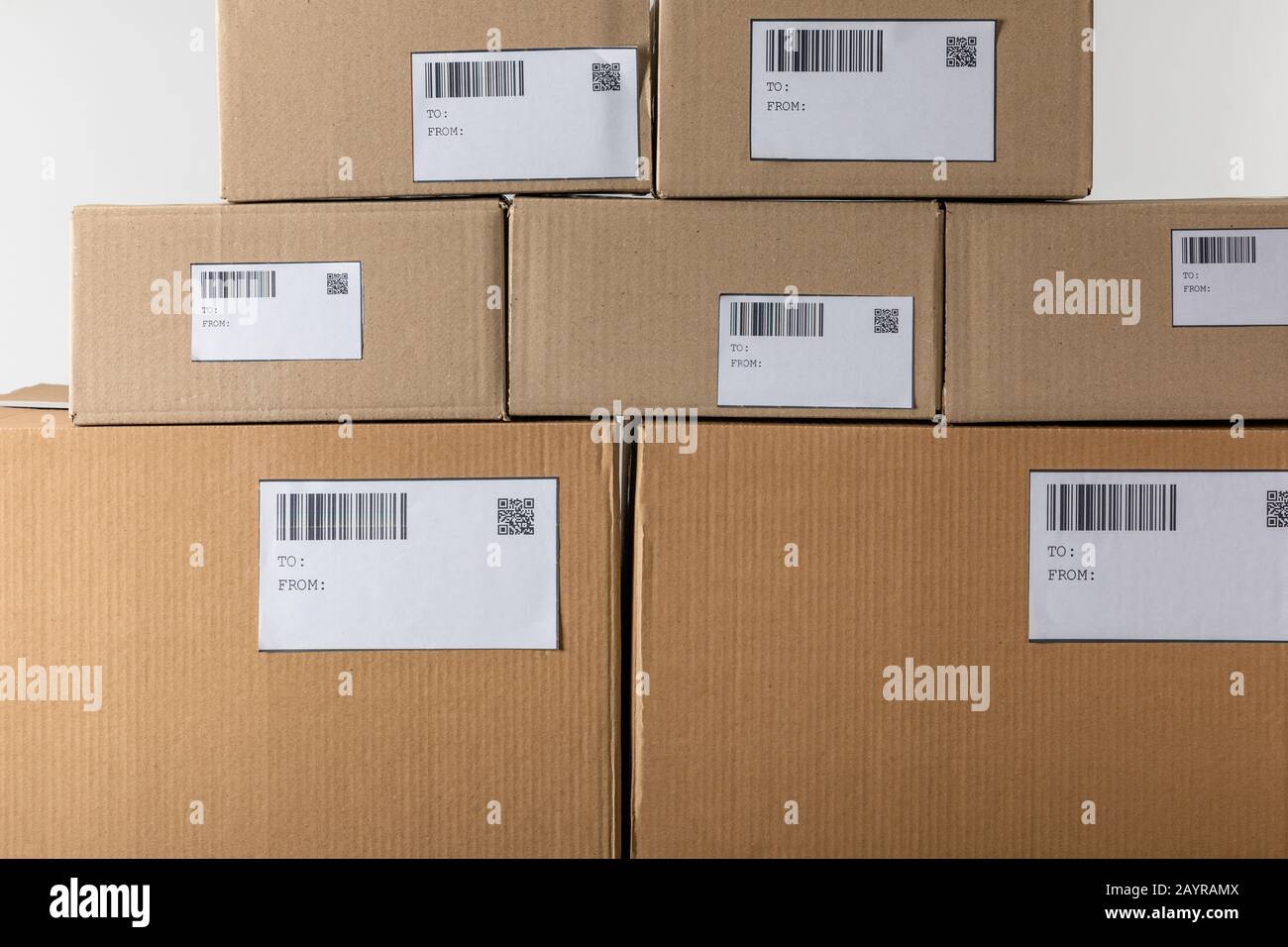 Cards with qr and barcodes on cardboard packages isolated on grey Stock ...