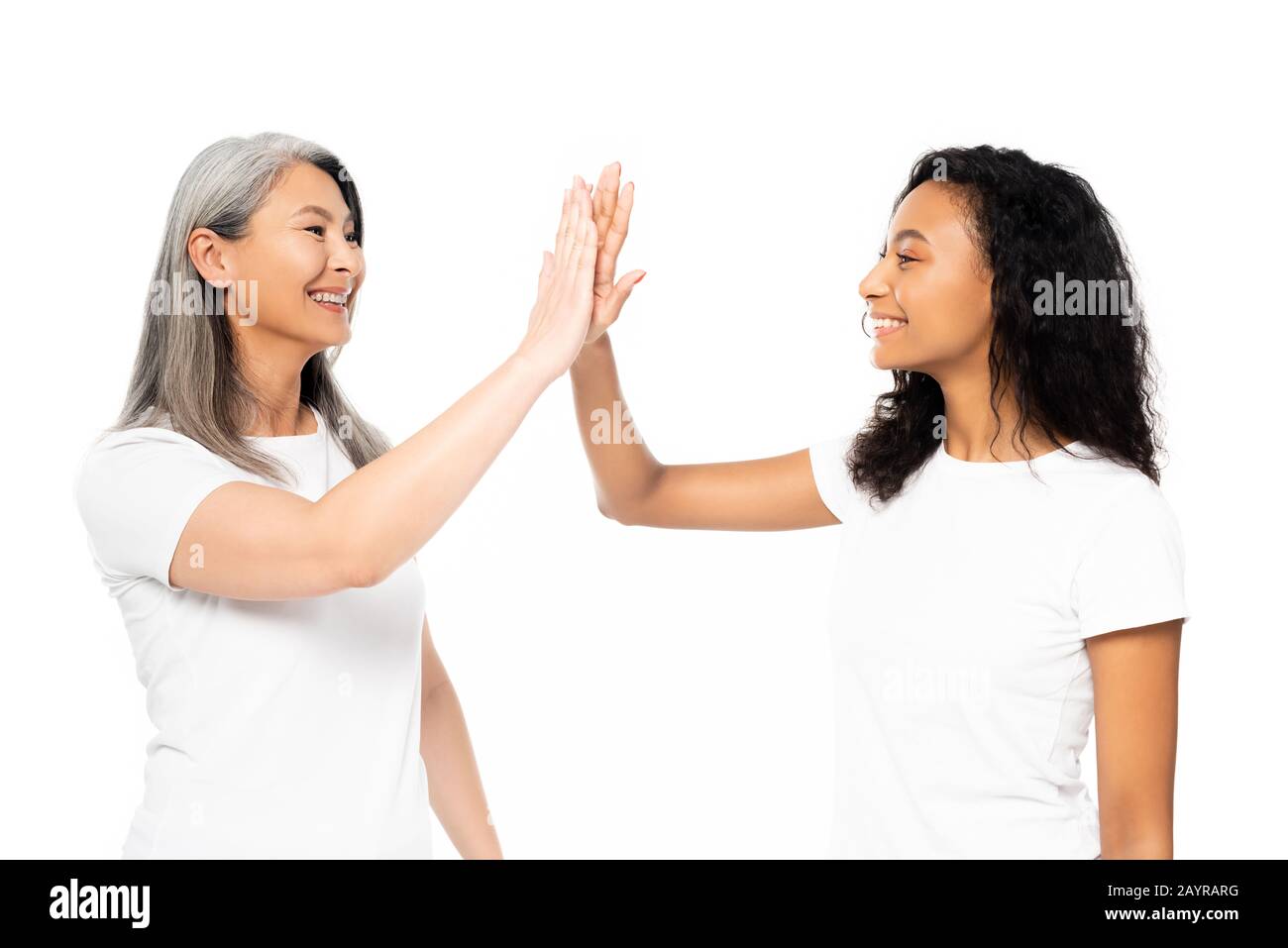 happy african american and asian women giving high five isolated on ...