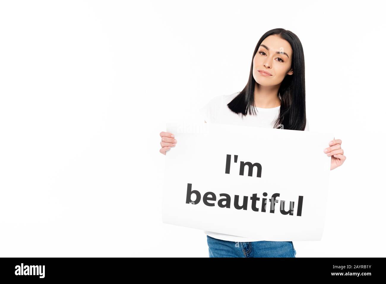 attractive woman looking at camera while holding poster with i`m ...