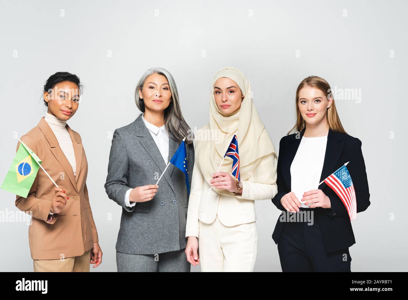multicultural women with flags of different countries isolated on white ...