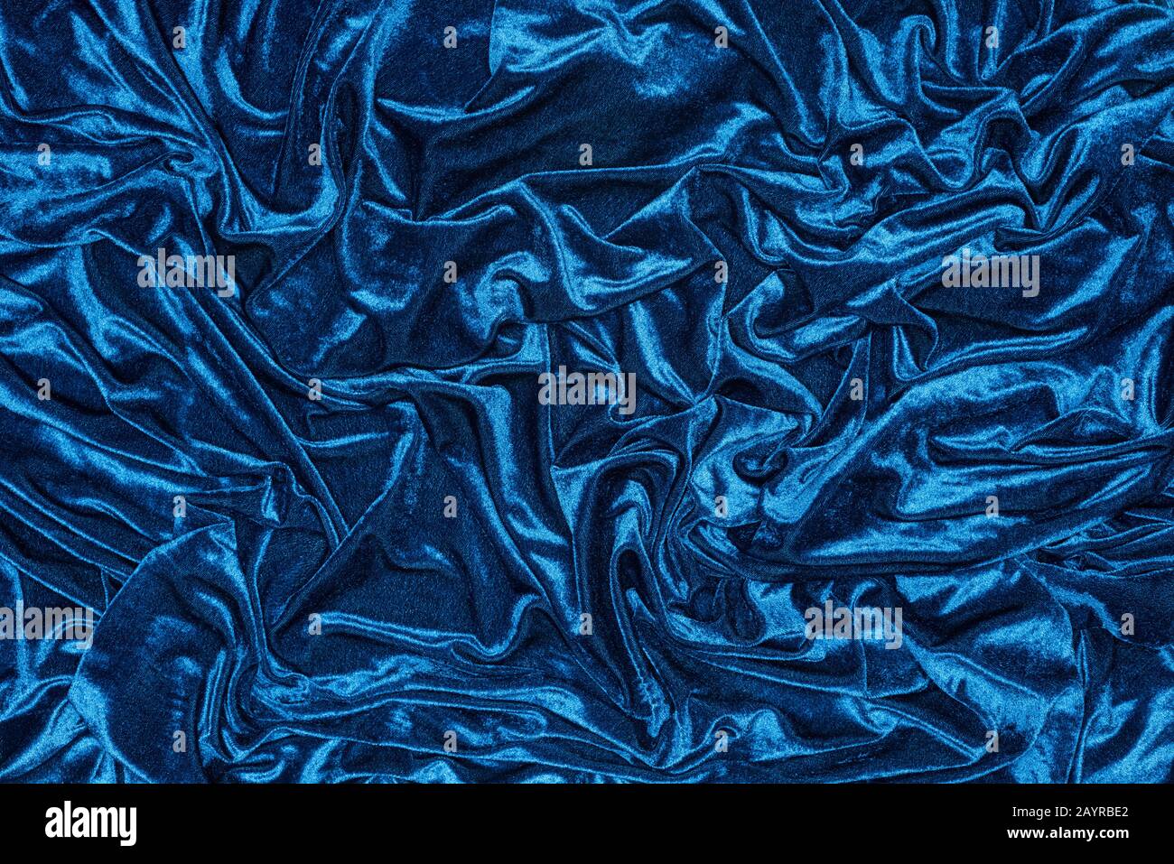 Top view of background with wavy blue cloth Stock Photo - Alamy