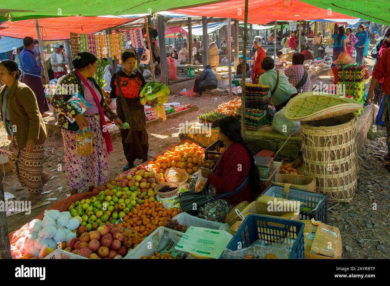 A colorful market scene in the village of Khaung Tai on Inle Lake in ...