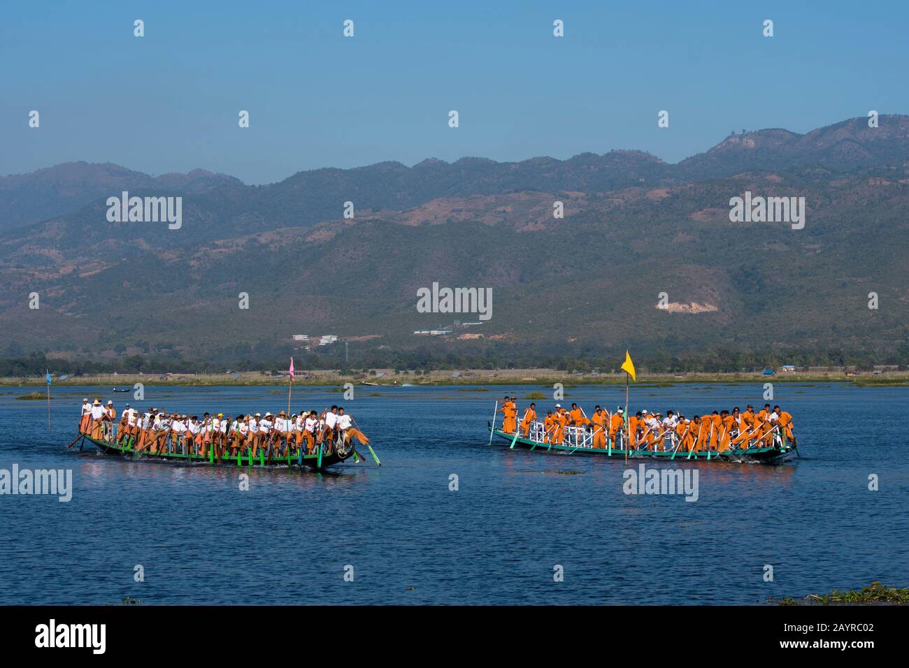 A traditional leg-rowing boat race accompanied with music on Inle Lake ...