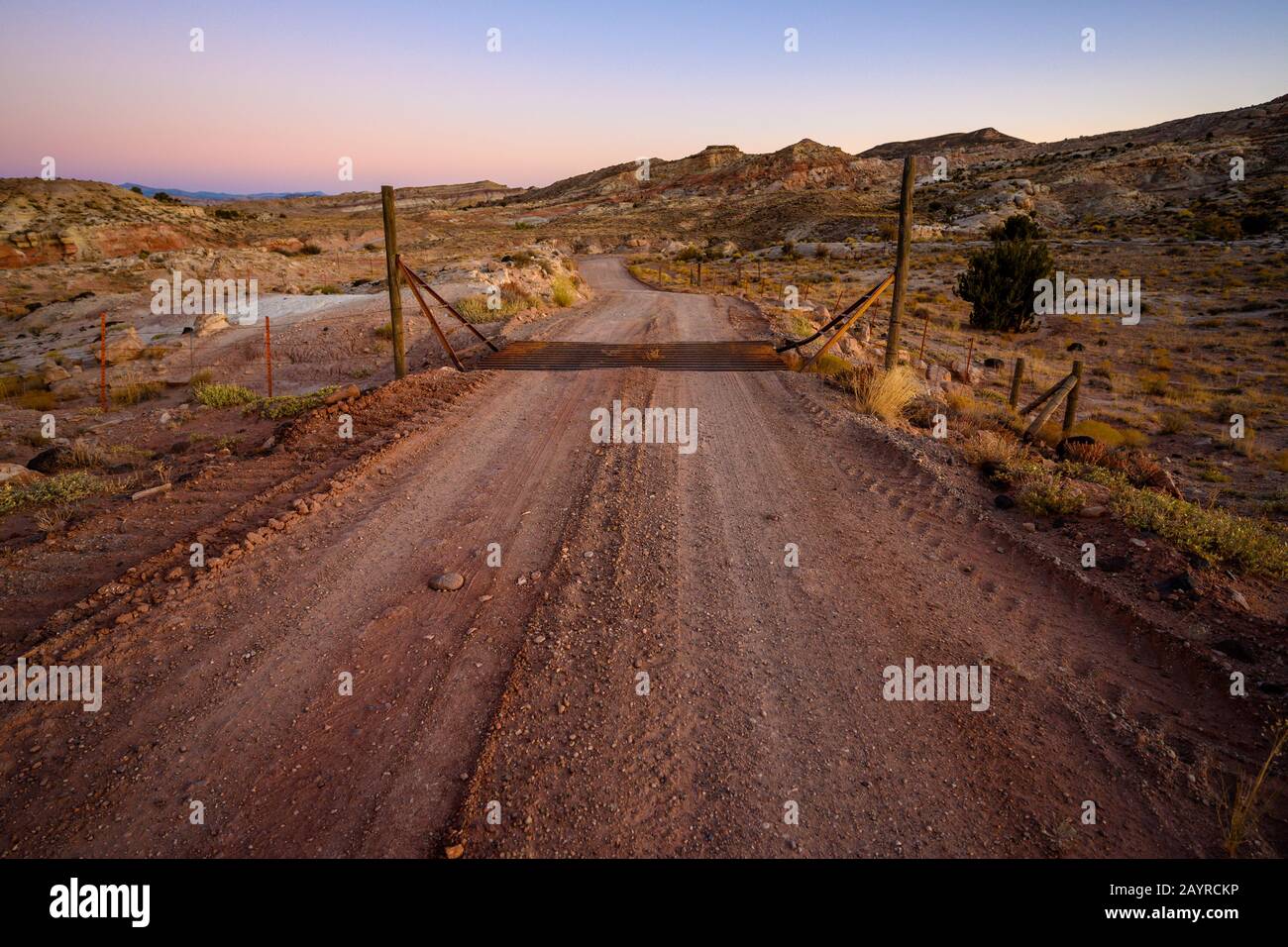 Road Leading Up to Cattle Guard Fence Stock Photo - Alamy