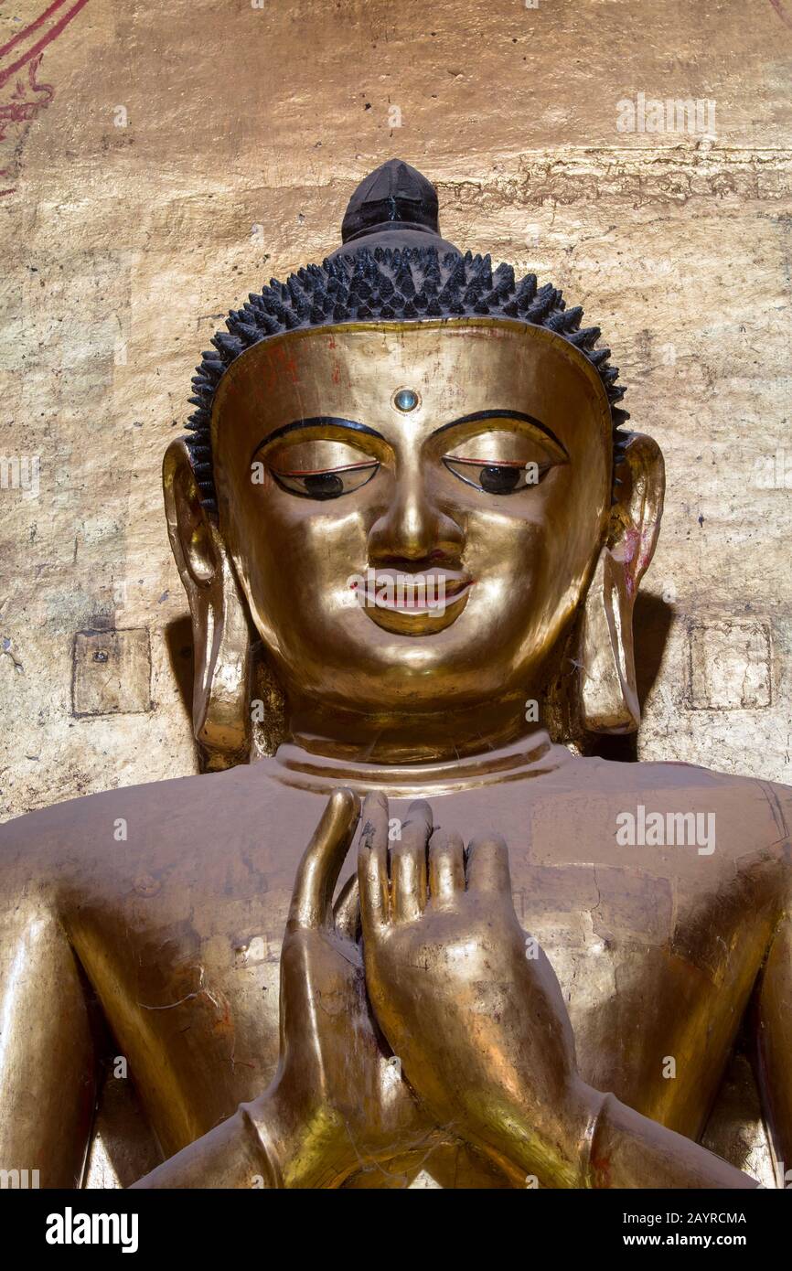 Close-up of one of the four Buddha statues inside the Ananda Temple ...