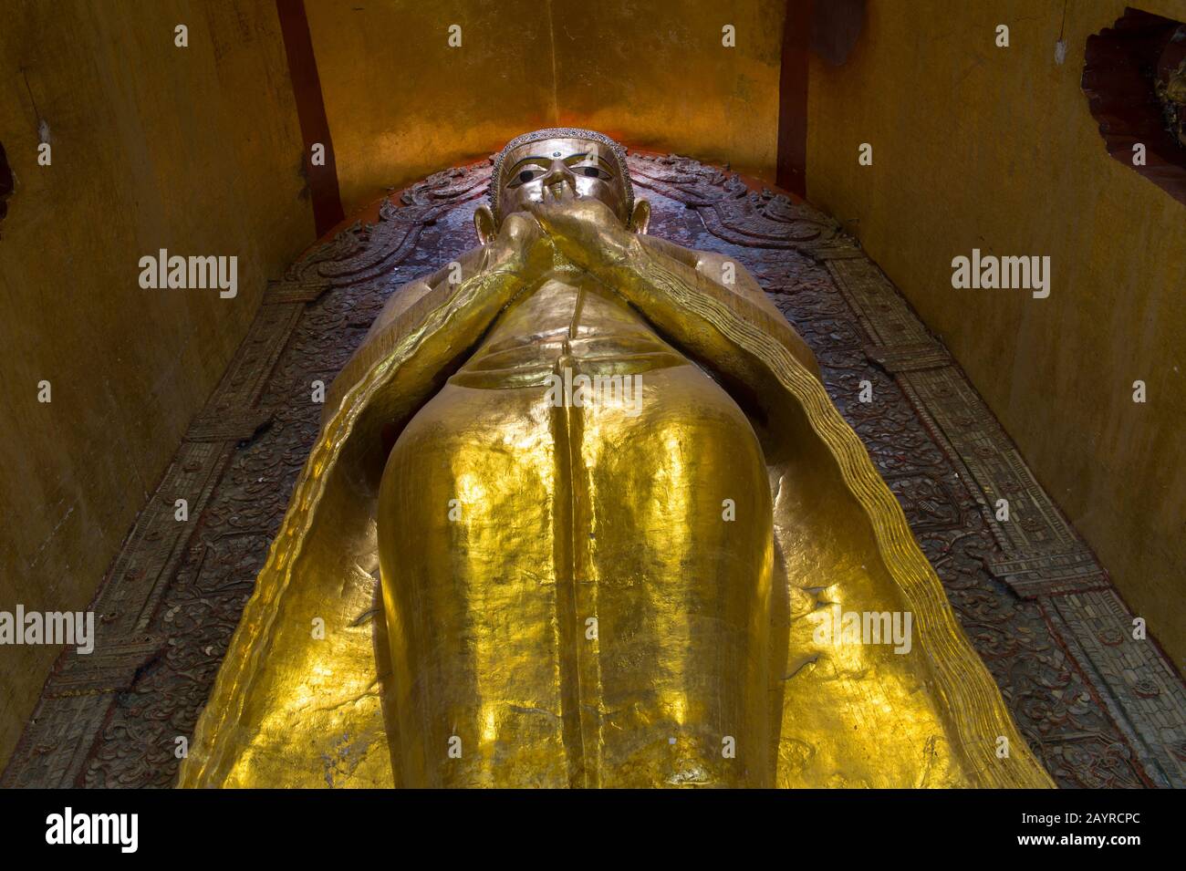 One of the four Buddha statues inside the Ananda Temple, which is a ...