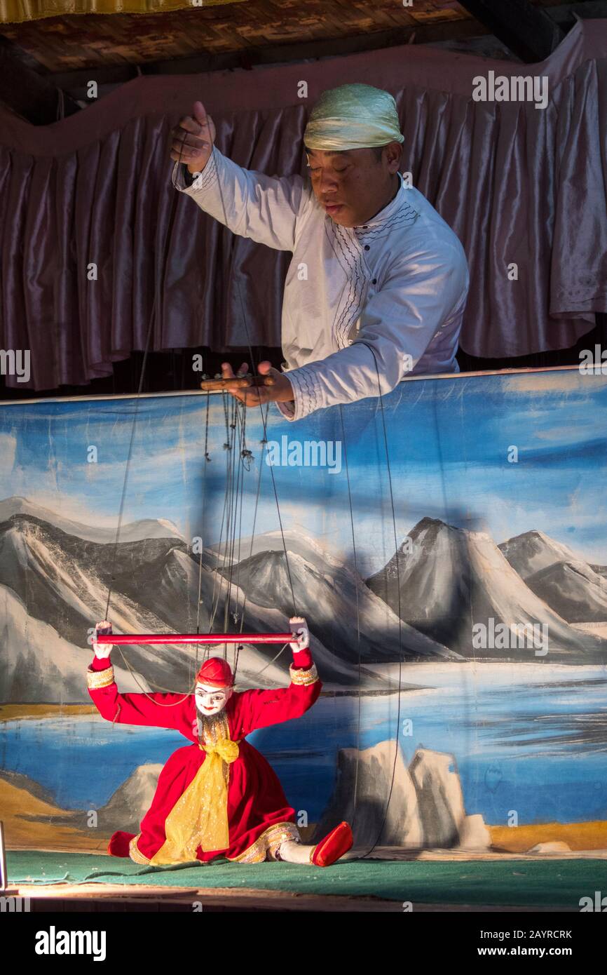 A puppeteer is performing a traditional puppet show in Bagan, Myanmar ...