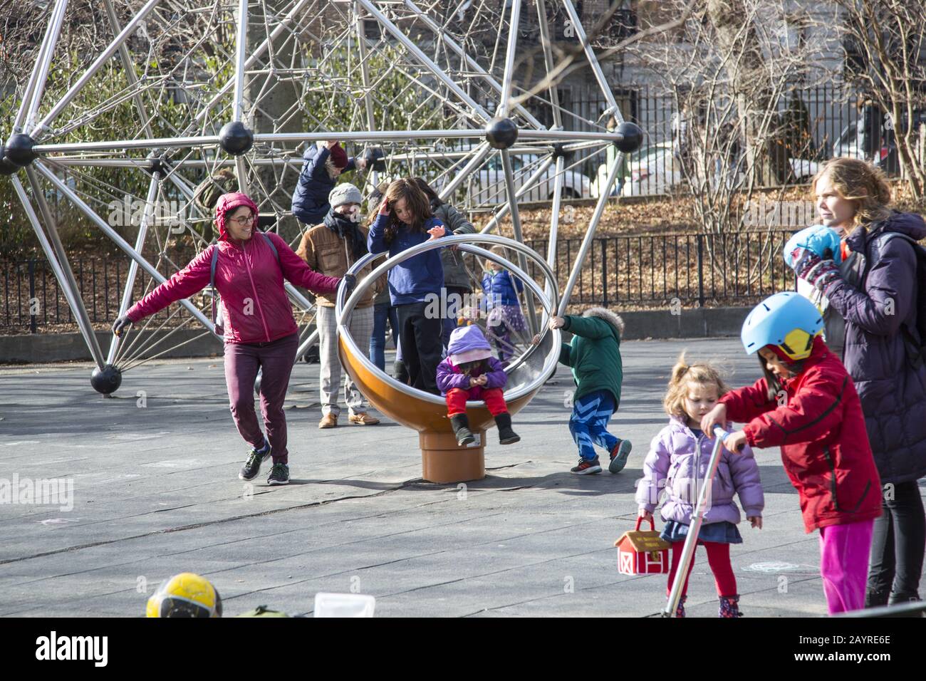 Children playing on playground equipment hi-res stock photography and ...