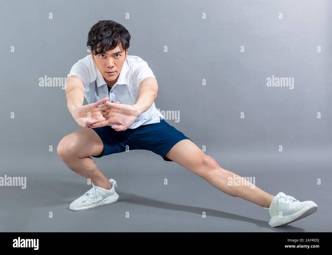Male athlete out stretching hands hi-res stock photography and images ...