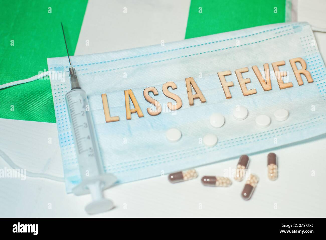 Nigerian flag under words Lassa fever outbreak concept. protective ...