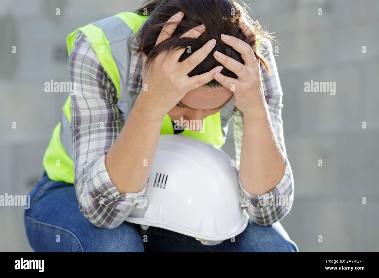 a tired female builder outdoors Stock Photo - Alamy