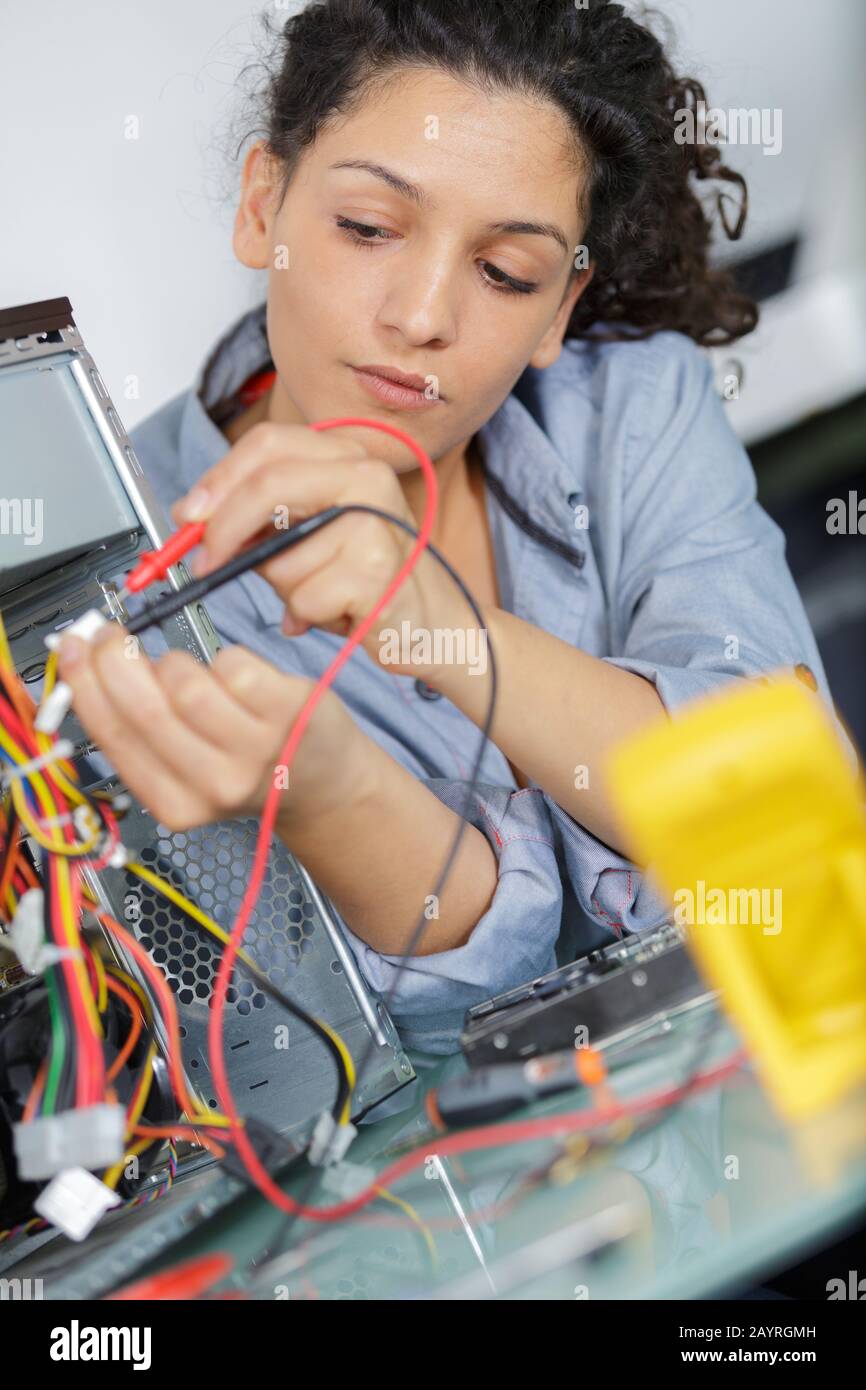 electrician woman fixing some cables Stock Photo - Alamy