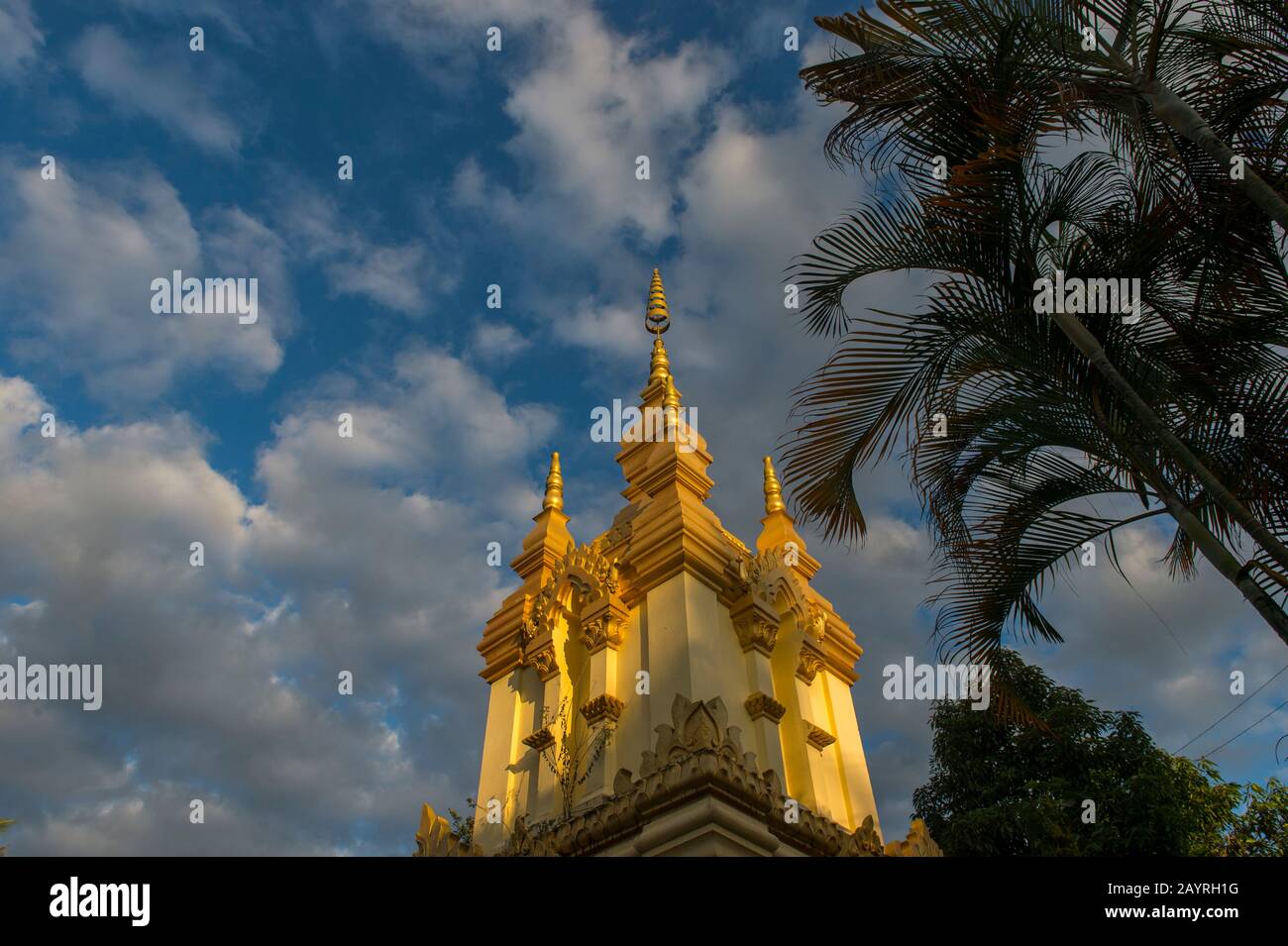 The evening light on the gilded stupa of Wat Prabat Tay (Wat Phra Bat ...