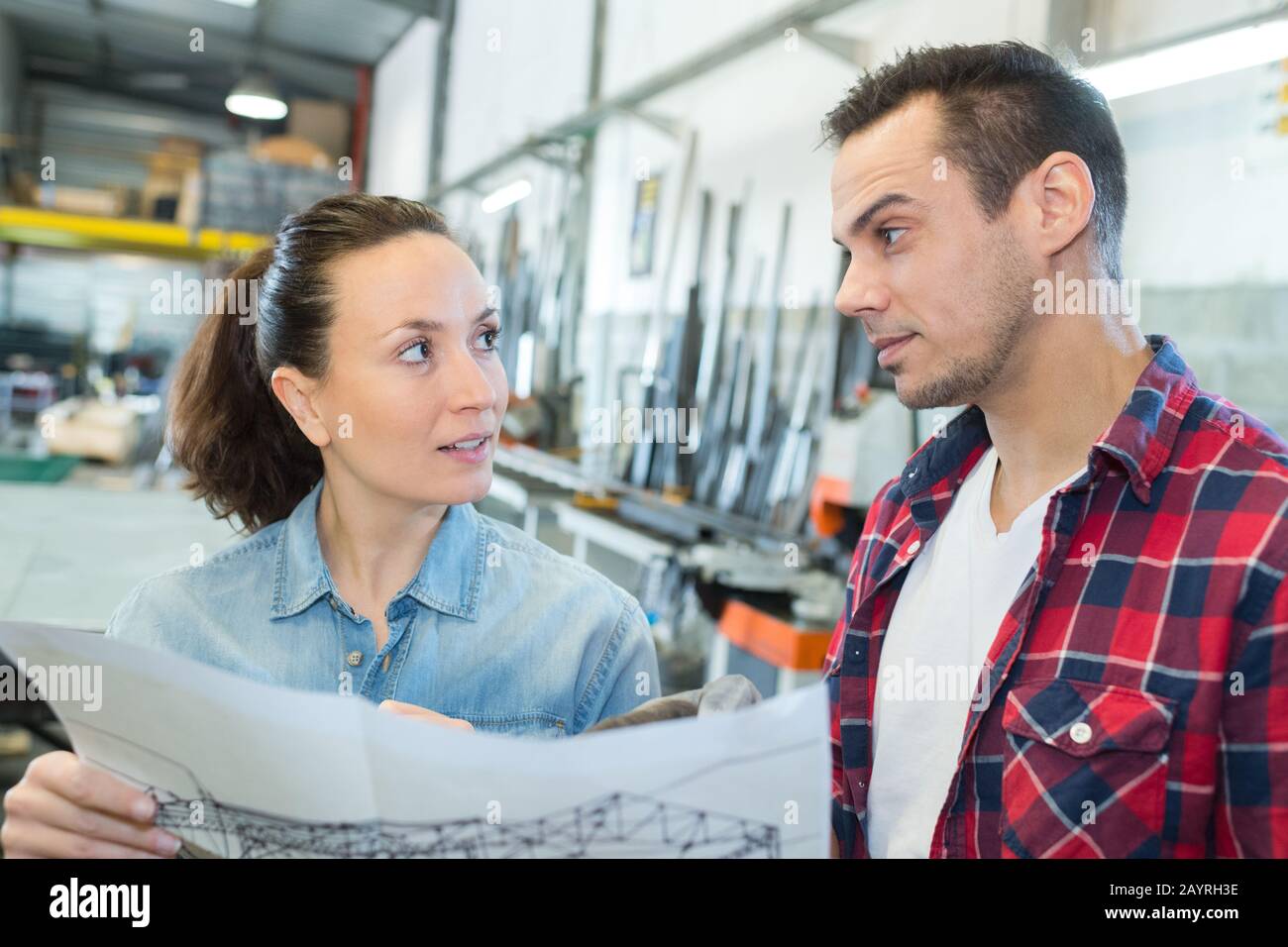 industrial planning workers discussing plans Stock Photo - Alamy