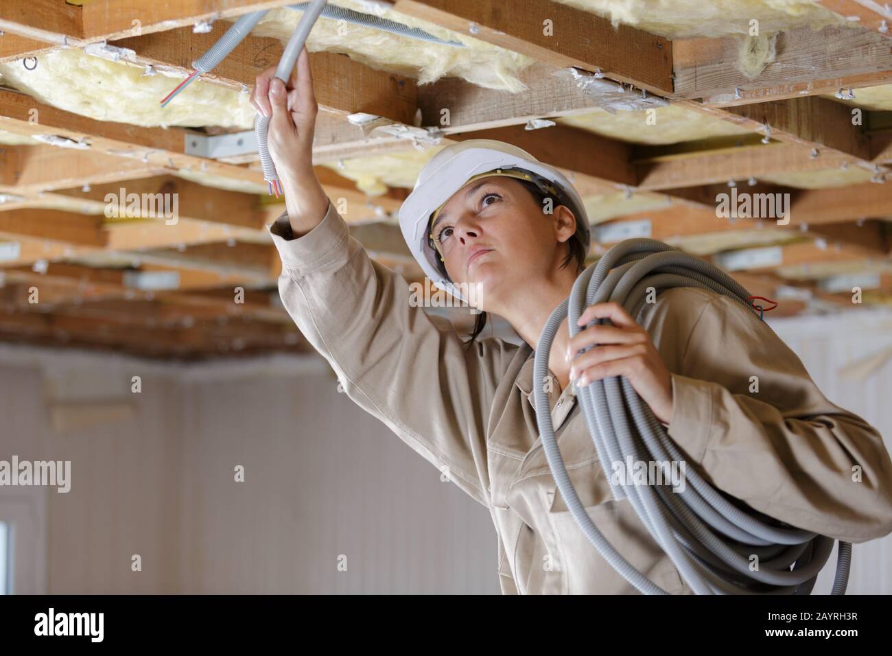 an interior designer working on ceiling Stock Photo - Alamy