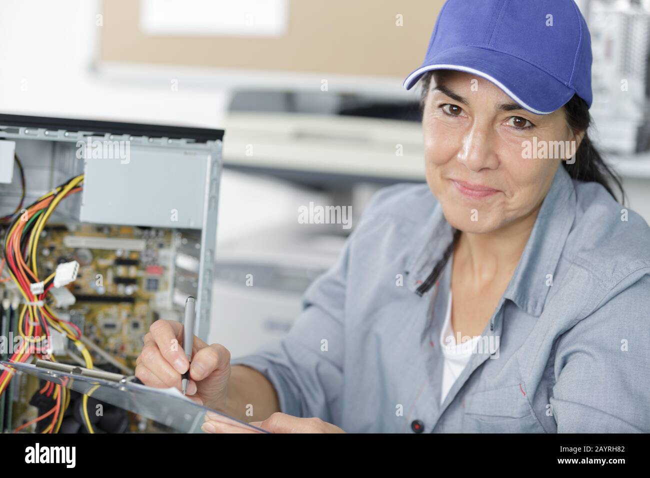 Woman repairing computer part hi-res stock photography and images - Alamy