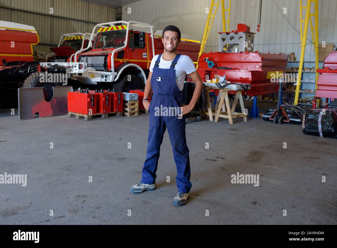 young male firetruck mechanic posing Stock Photo - Alamy