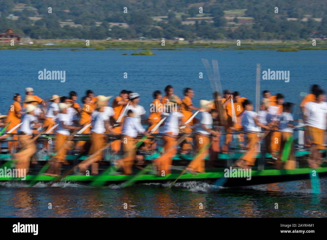 A traditional leg-rowing boat race accompanied by traditional music on ...