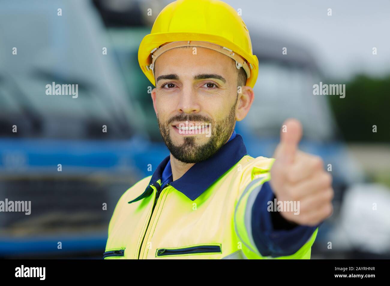 builder giving thumb up as sign of success Stock Photo - Alamy