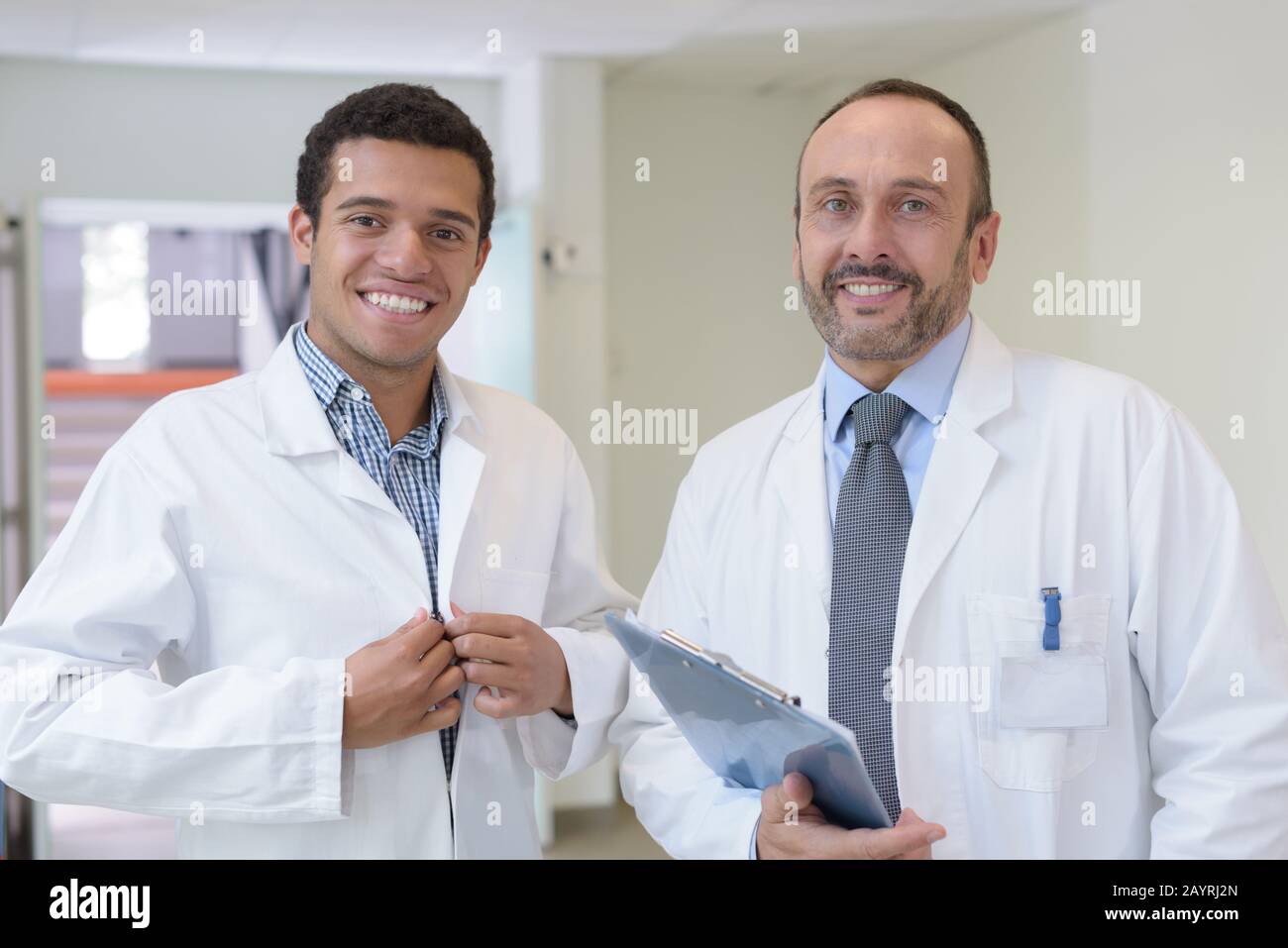 two doctors looking at camera Stock Photo - Alamy