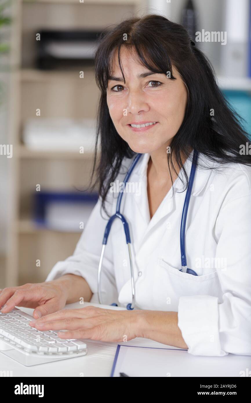 Female doctor typing on computer hi-res stock photography and images ...